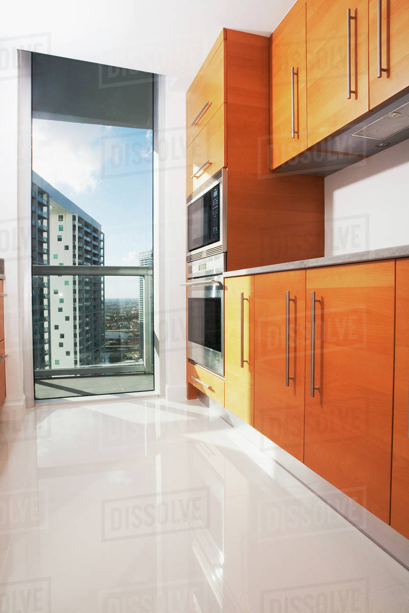 Cabinets and window in modern kitchen - Stock Photo - Dissolve