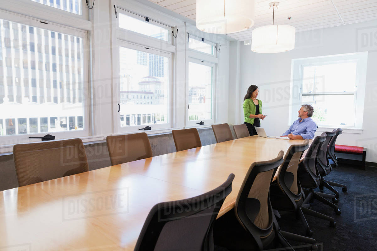 Business people talking in conference room - Royalty-free Stock Photo ...