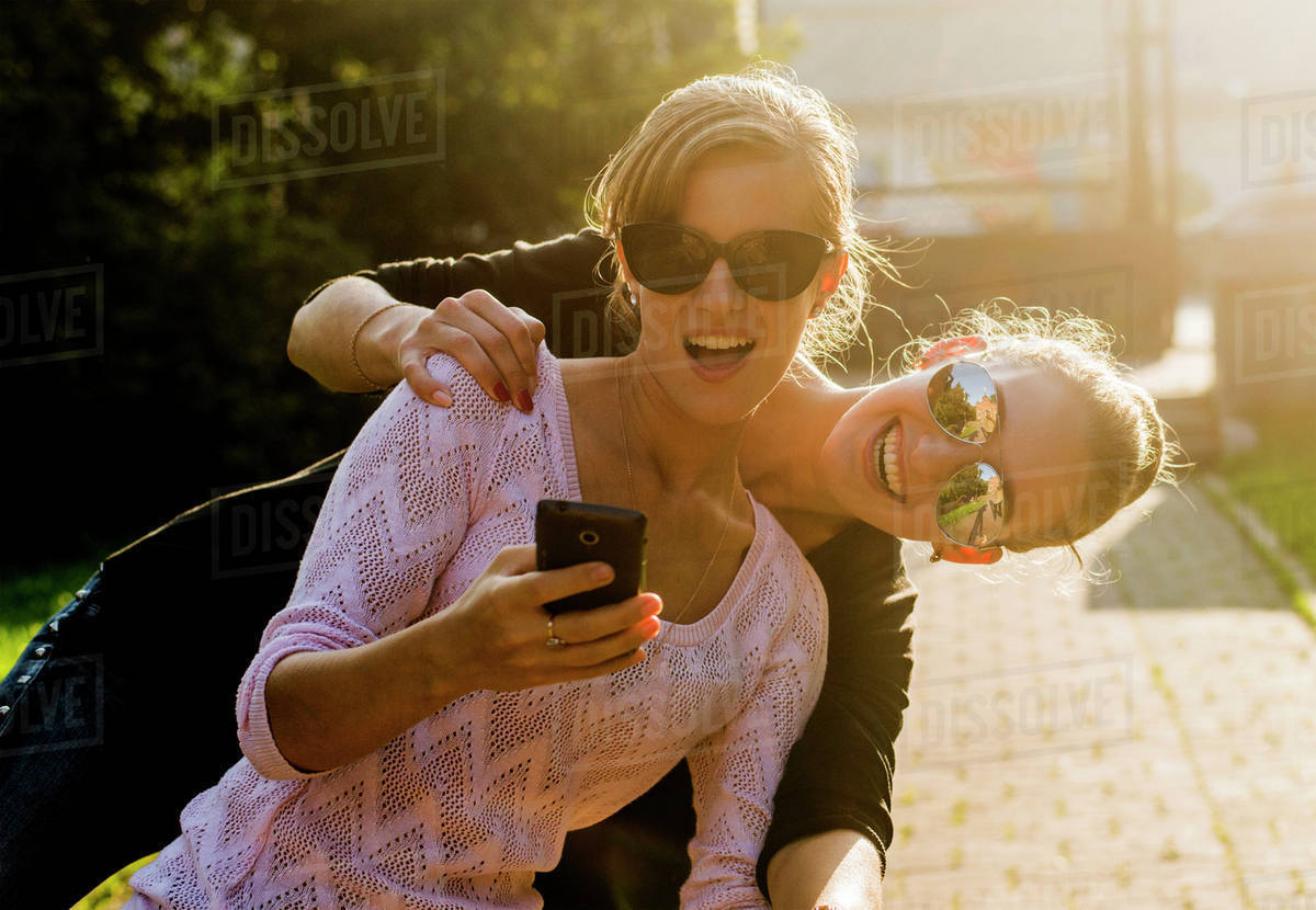 Caucasian women taking cell phone selfie - Royalty-free Stock Photo ...