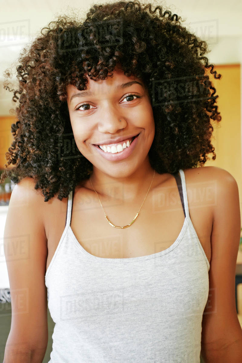 Mixed race woman smiling - Royalty-free Stock Photo | Dissolve