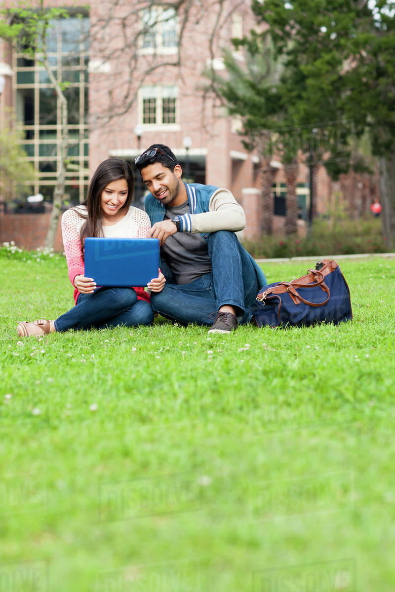 Students using laptop on campus - Royalty-free Stock Photo | Dissolve