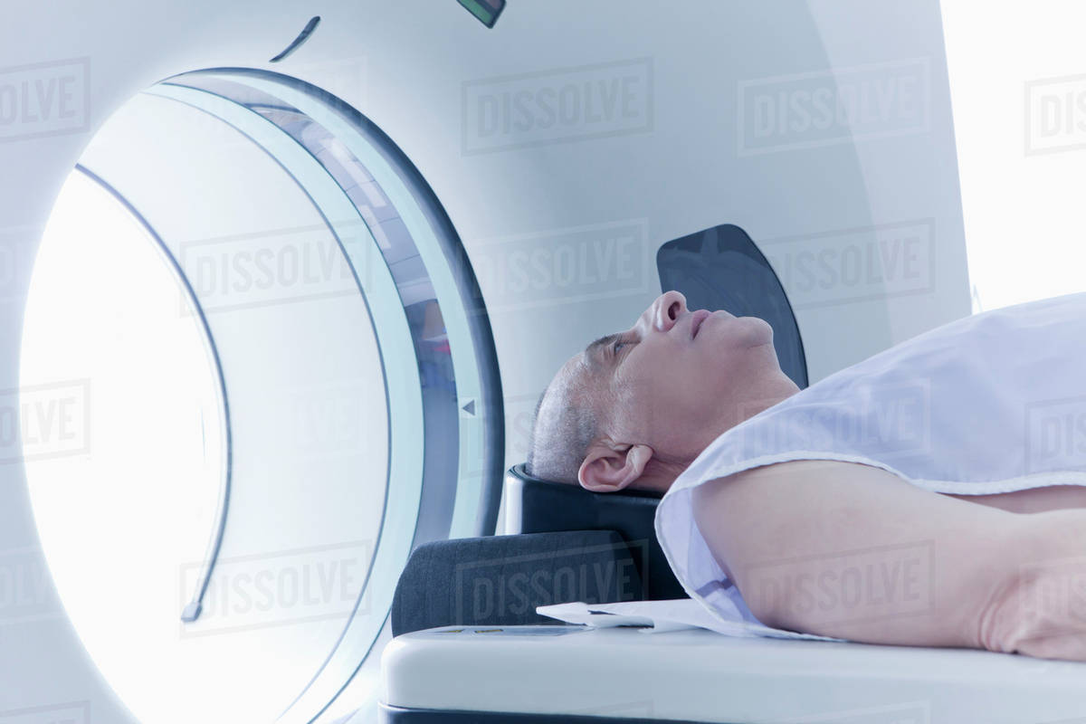Older Hispanic man laying in MRI scanner - Royalty-free Stock Photo ...