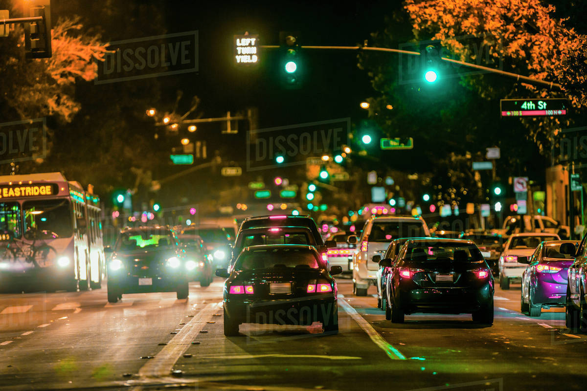 Cars driving in city traffic at night - Royalty-free Stock Photo | Dissolve