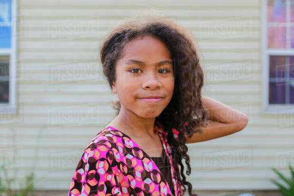 Pacific Islander girl smiling outdoors - Stock Photo - Dissolve