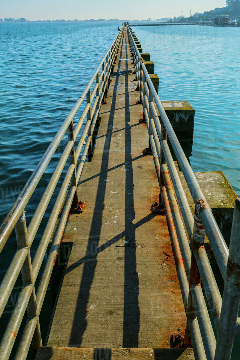 High angle view of concrete walkway over bay - Royalty-free Stock Photo ...