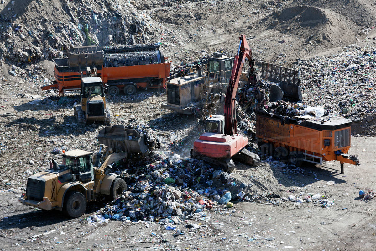 Machinery working in landfill - Stock Photo - Dissolve