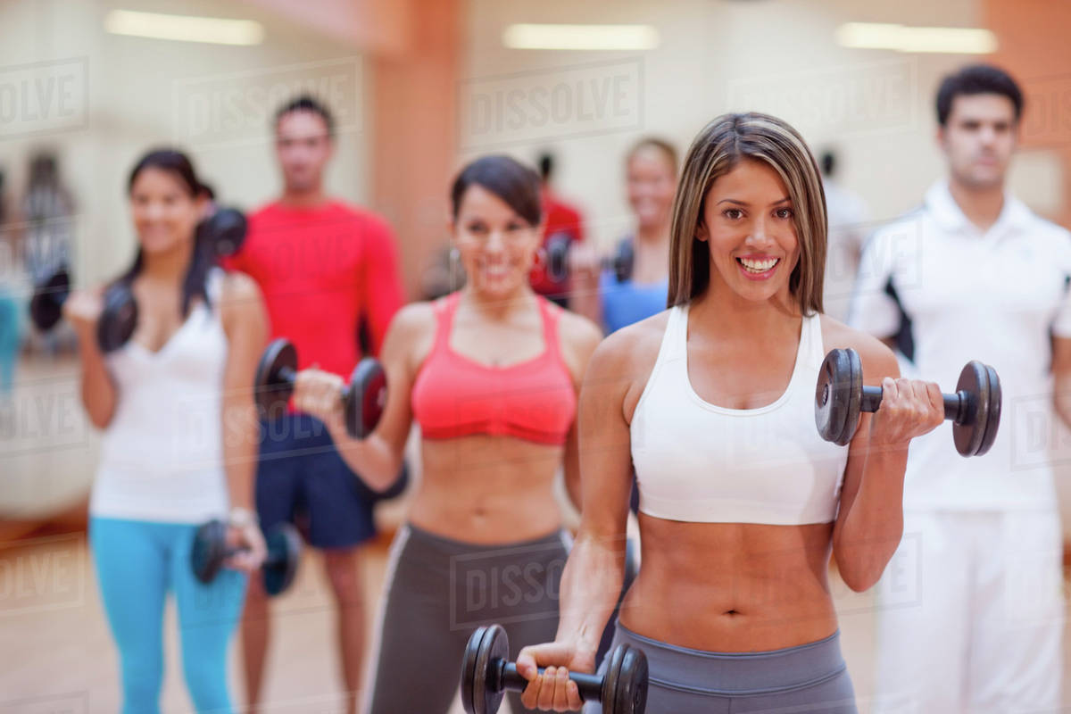 Hispanic people taking exercise class in gym - Royalty-free Stock Photo ...