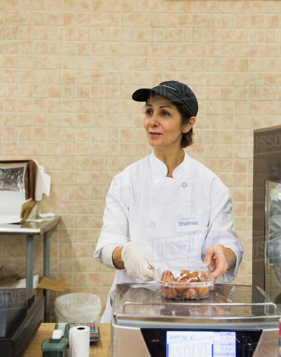 Cook working in kitchen - Stock Photo - Dissolve