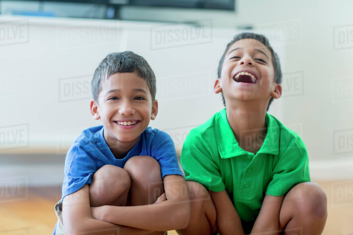 Hispanic boys smiling - Stock Photo - Dissolve