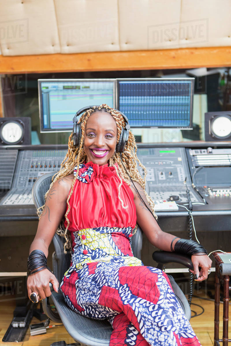 African American singer listening to track in studio - Royalty-free ...