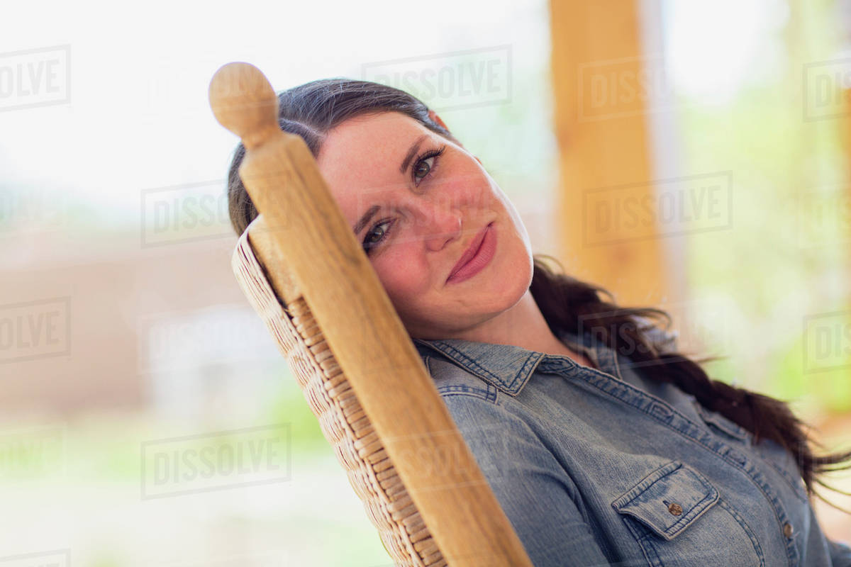 Caucasian woman relaxing in rocking chair - Royalty-free Stock Photo ...