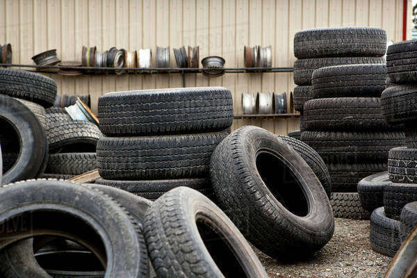 Tires in junkyard - Stock Photo - Dissolve