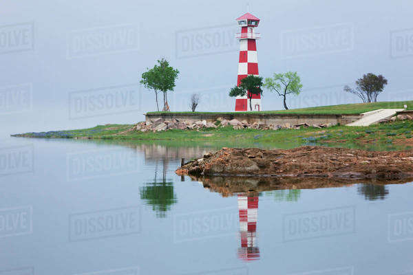 Lighthouse on a Beach - Stock Photo - Dissolve