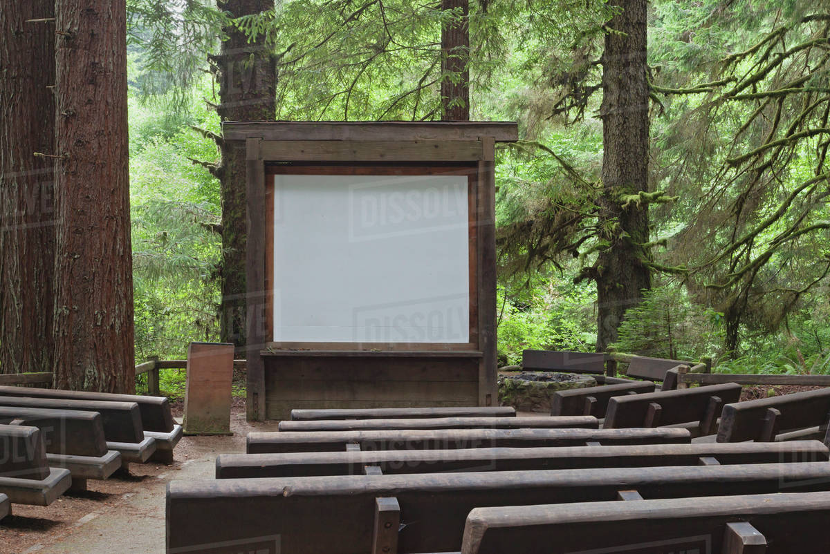 Amphitheater with movie screen in woods - Stock Photo - Dissolve