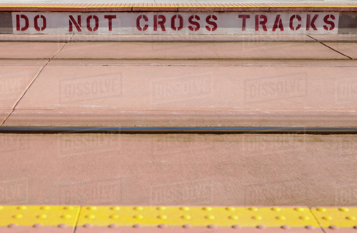 Do Not Cross Tracks sign at Light rail train station - Royalty-free ...