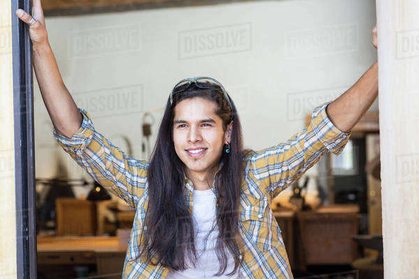 Mixed race man standing in doorway - Royalty-free Stock Photo | Dissolve