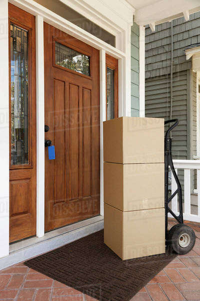 Cardboard boxes on front porch of house - Royalty-free Stock Photo ...