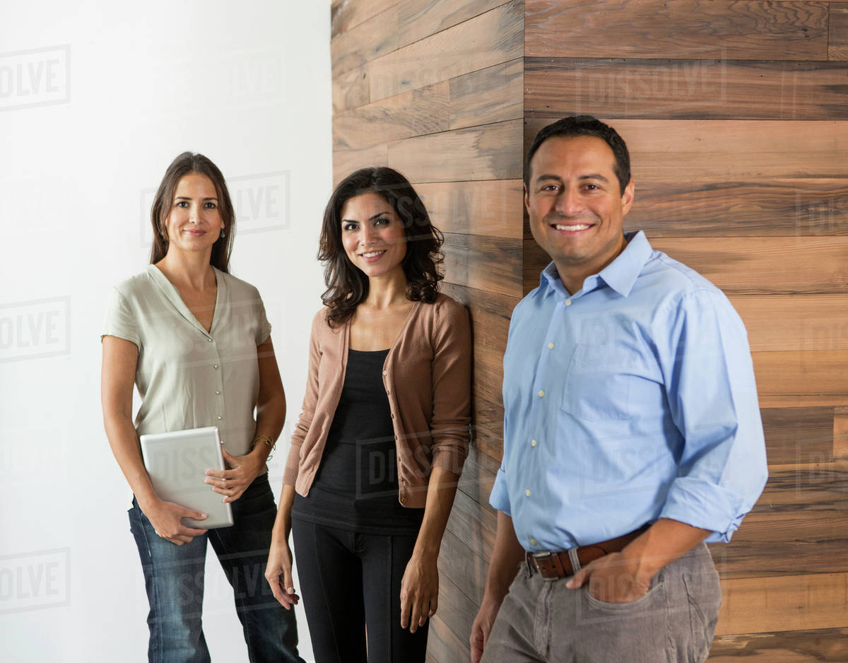 Business people smiling in office - Royalty-free Stock Photo | Dissolve