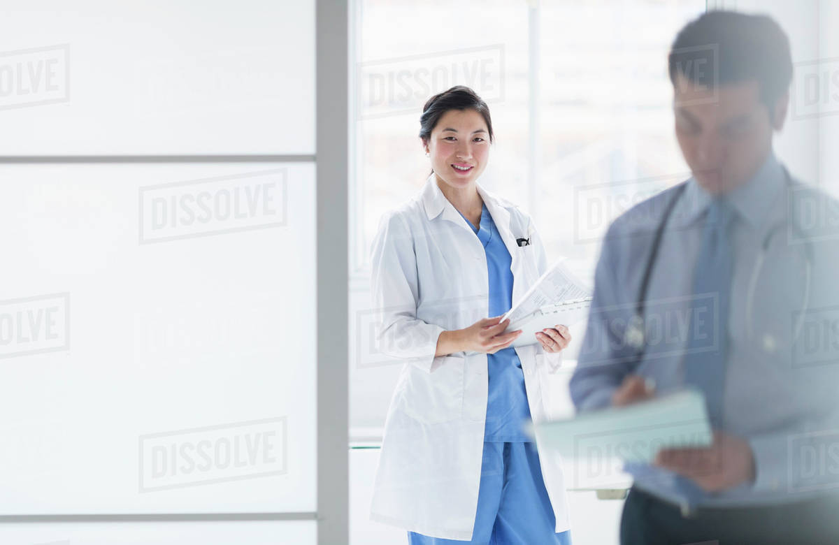 Doctors working in hospital - Royalty-free Stock Photo | Dissolve
