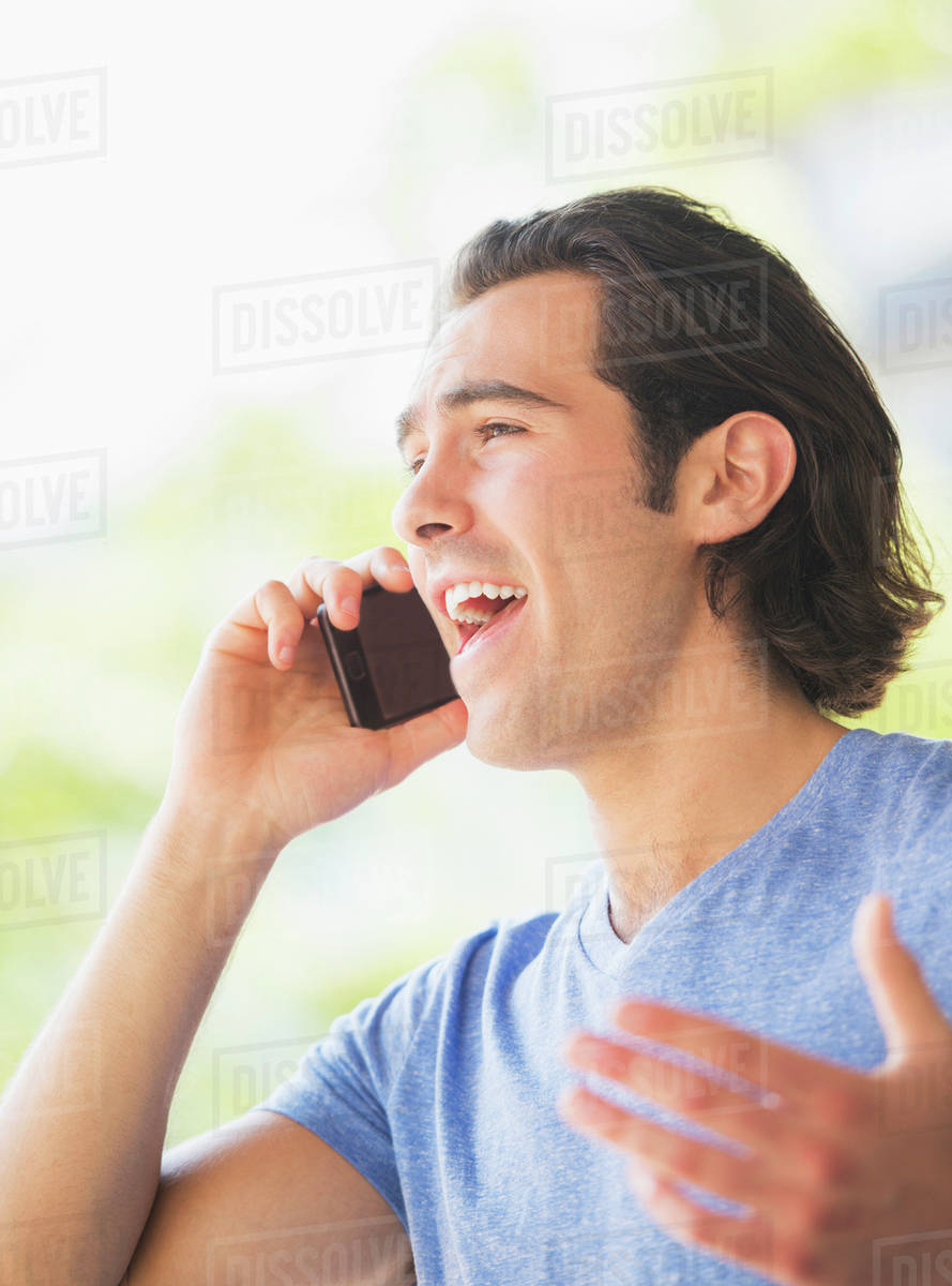 Caucasian man talking on cell phone - Royalty-free Stock Photo | Dissolve