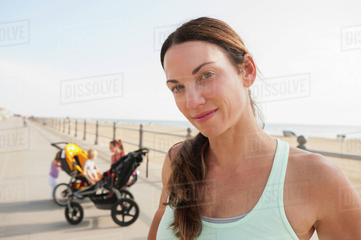 Caucasian woman smiling on beach boardwalk - Royalty-free Stock Photo ...