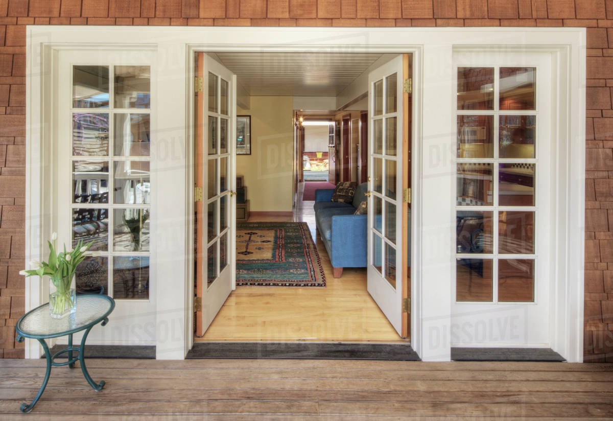 Glass doors on wooden patio - Stock Photo - Dissolve