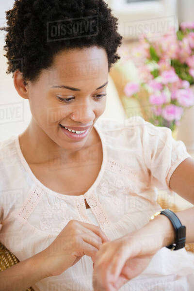 African American woman checking the time - Royalty-free Stock Photo ...