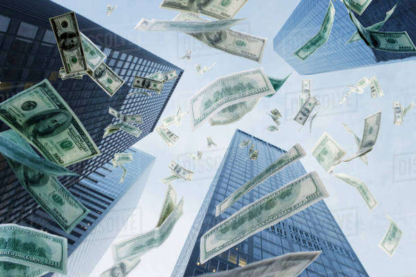 One hundred dollar bills falling from sky - Stock Photo - Dissolve
