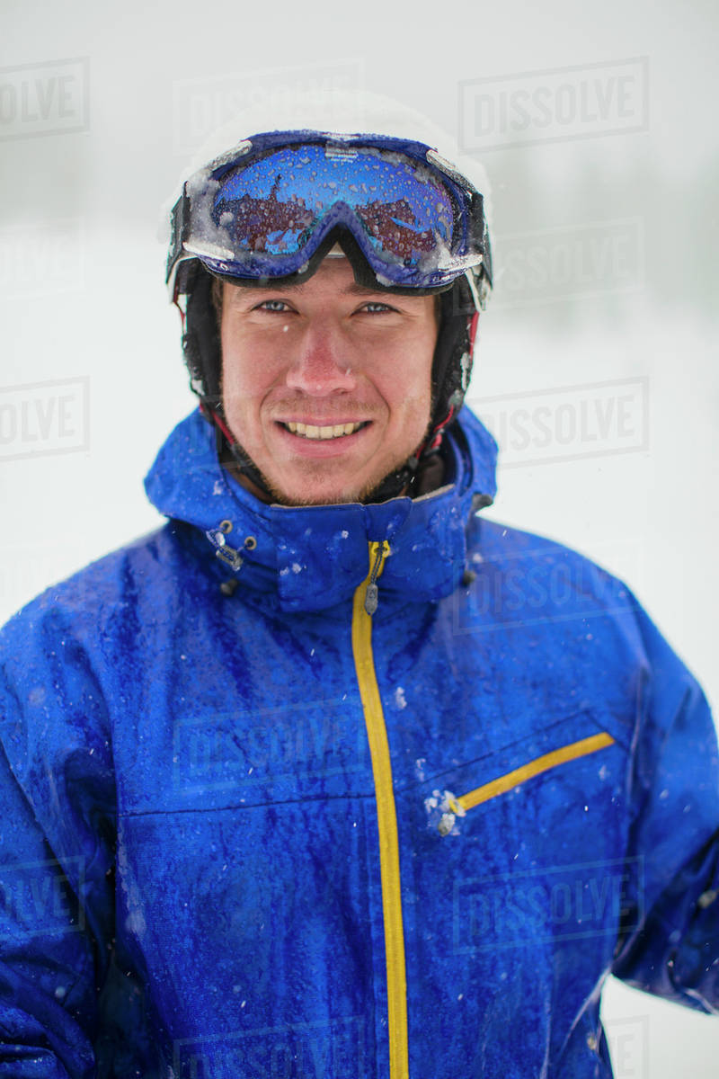 Caucasian man wearing ski gear in snow - Royalty-free Stock Photo ...