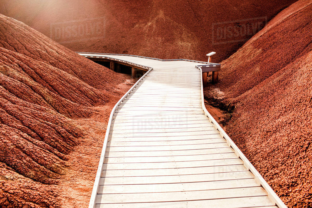 Wooden walkway in desert hills - Royalty-free Stock Photo | Dissolve