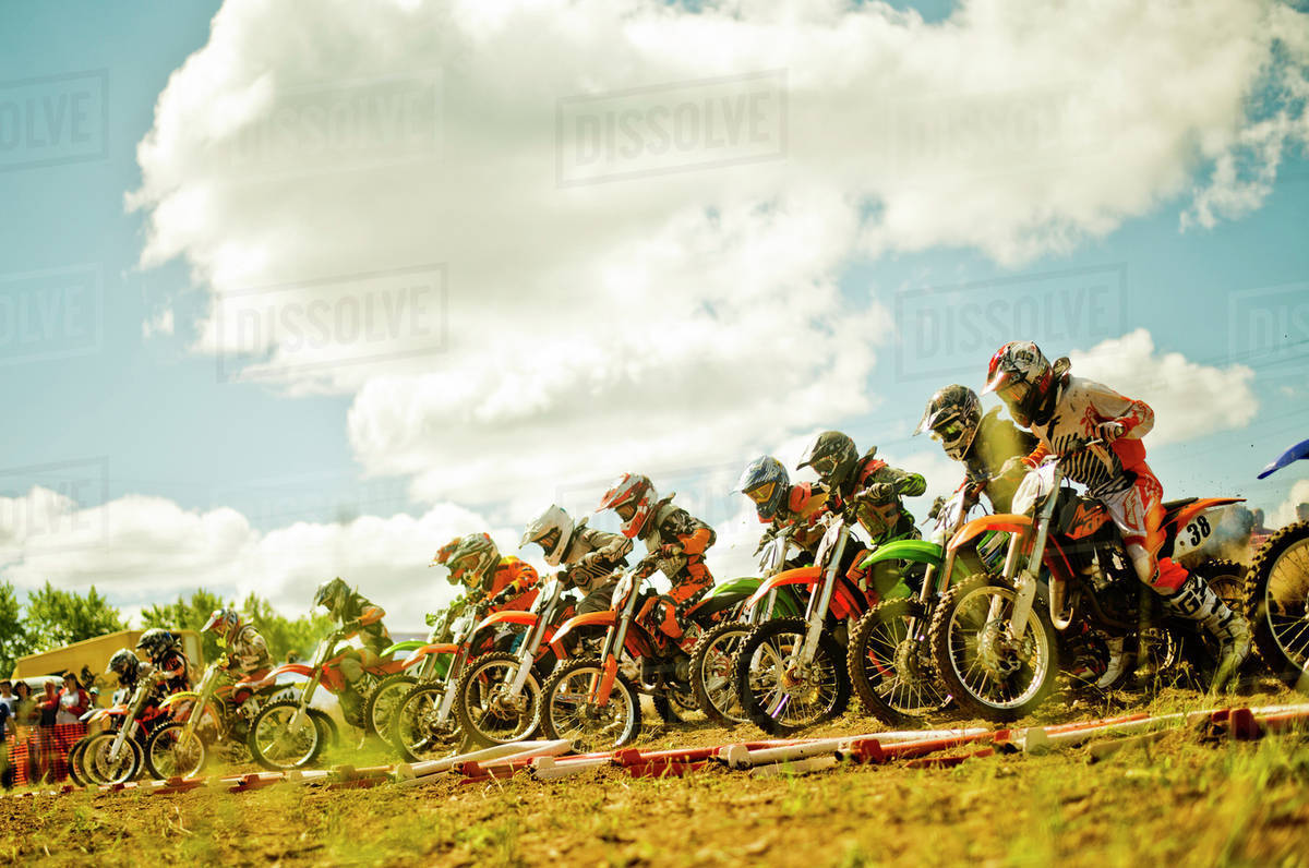 Caucasian motocross bikers ready for race - Stock Photo - Dissolve