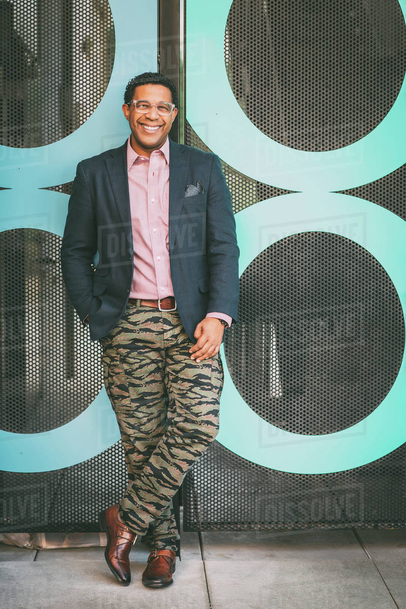 Stylish Mixed race businessman smiling outdoors - Royalty-free Stock ...