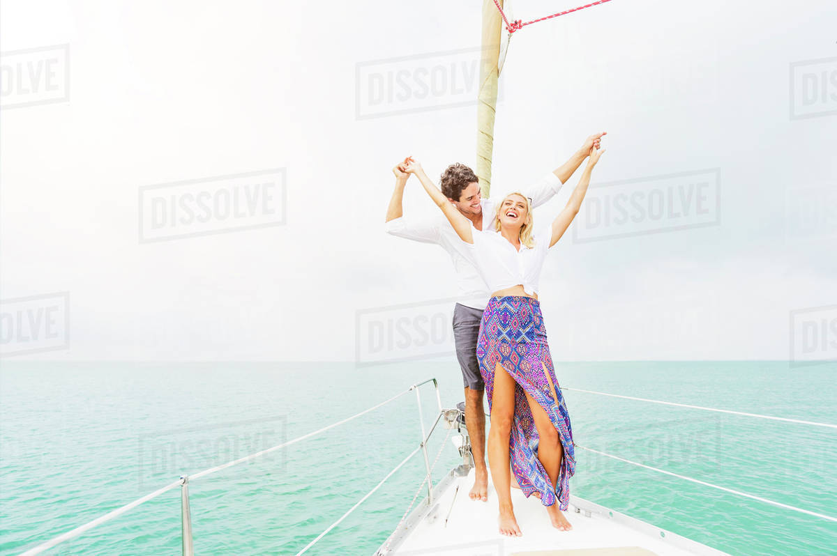 Couple dancing on deck of sailboat - Royalty-free Stock Photo | Dissolve