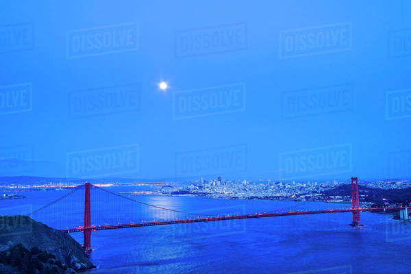Moon in night sky over Golden Gate Bridge, San Francisco, California ...