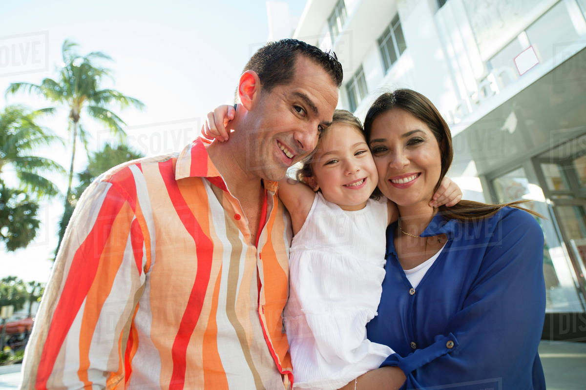 Close up of Hispanic family hugging outdoors - Royalty-free Stock Photo ...