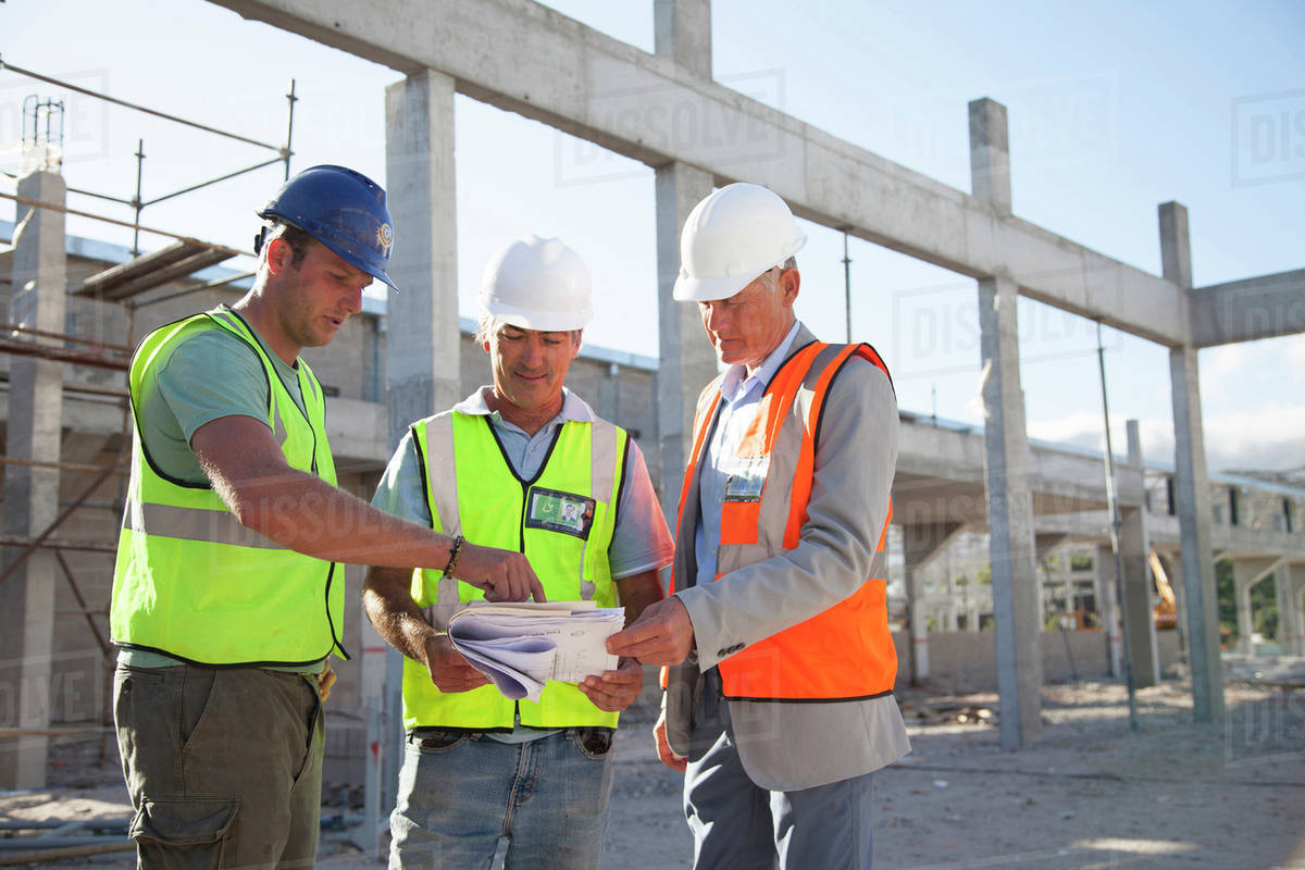 Architects talking at construction site - Royalty-free Stock Photo ...