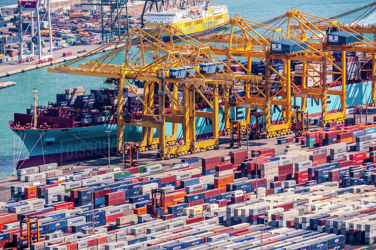 Aerial view of cranes and containers in urban shipyard - Stock Photo ...
