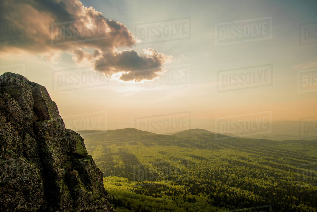 Rocky hilltop over rural landscape - Royalty-free Stock Photo | Dissolve