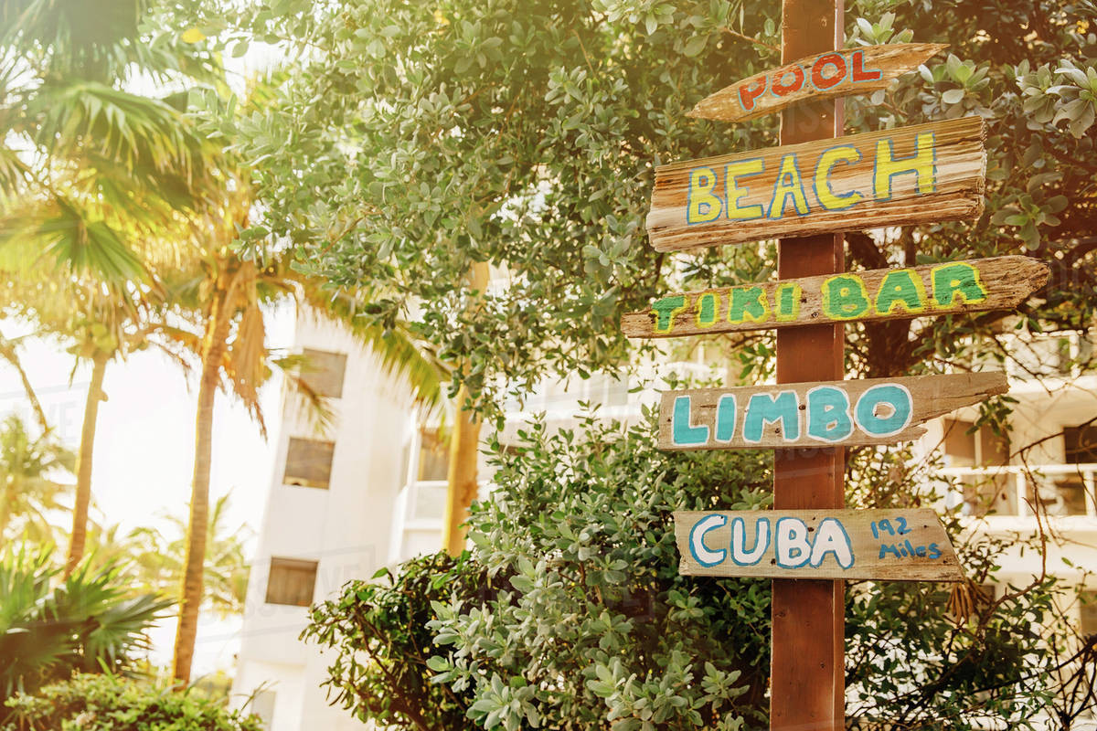 Tourist signs for beach and pool - Stock Photo - Dissolve
