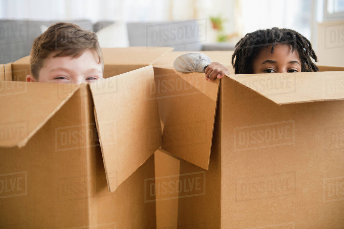 Close up of boys playing in cardboard boxes - Royalty-free Stock Photo ...