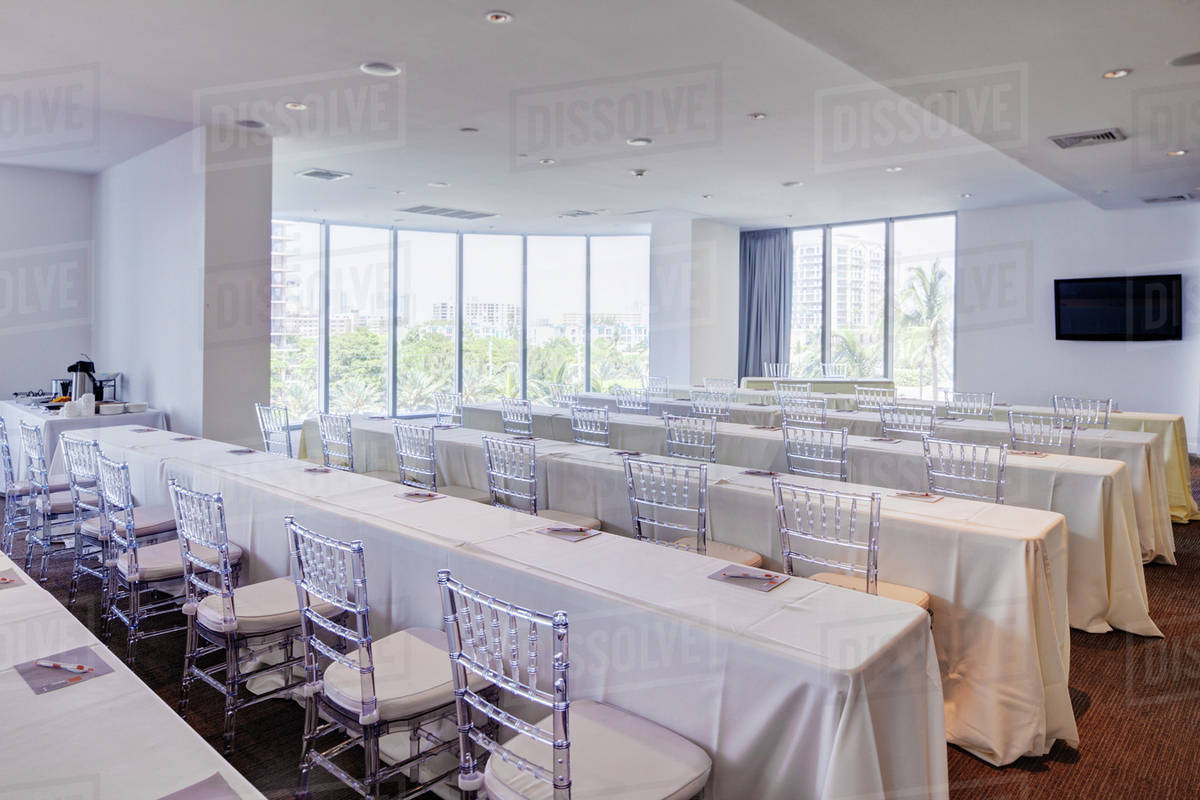 Empty tables in banquet hall - Royalty-free Stock Photo | Dissolve