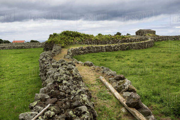 Elevated walkway between rural fields - Royalty-free Stock Photo | Dissolve