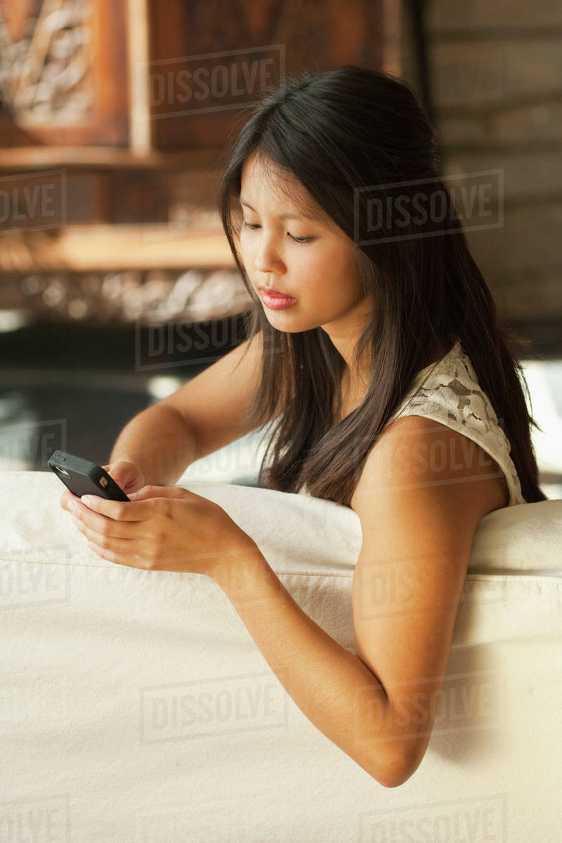 Asian woman text messaging on cell phone - Royalty-free Stock Photo ...