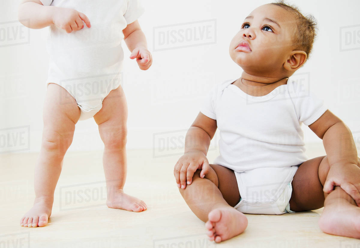 Babies playing together - Royalty-free Stock Photo | Dissolve