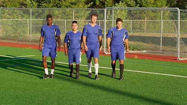 Soccer players walking onto the field - Stock Video Footage - Dissolve