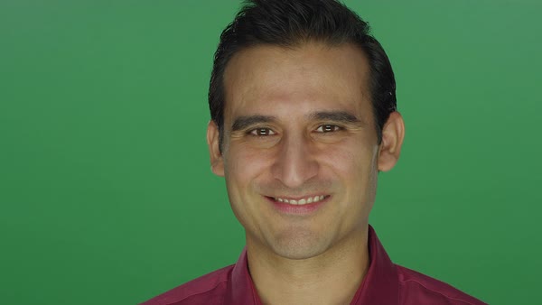 Man nodding and smiling, on a green screen studio background - 4K ...