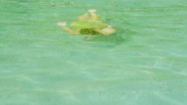 Woman emerges from water in a pool - 4K Royalty-free Stock Video ...
