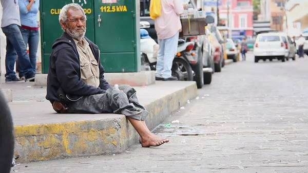 A homeless man sits on the curb in a small town in Mexico - Stock Video ...