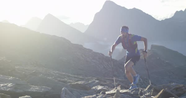 Man climbing run on mountain rise.Trail runner running to top peak ...