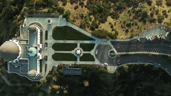 Aerial top view of famous observatory with people at parking lot, drone ...